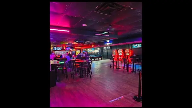 Bowling bar game-room kitchen party room’s pool table darts boards in ...