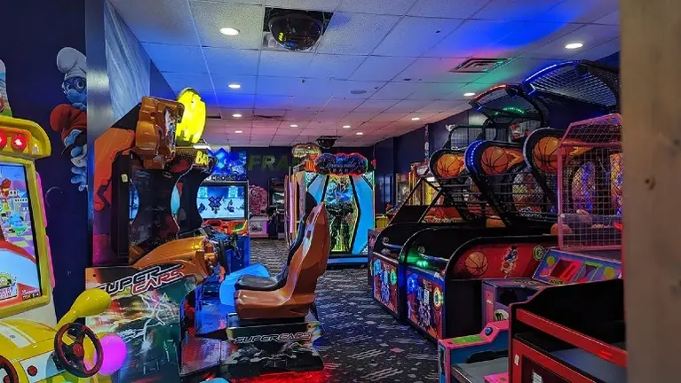 Bowling bar game-room kitchen party room’s pool table darts boards in ...